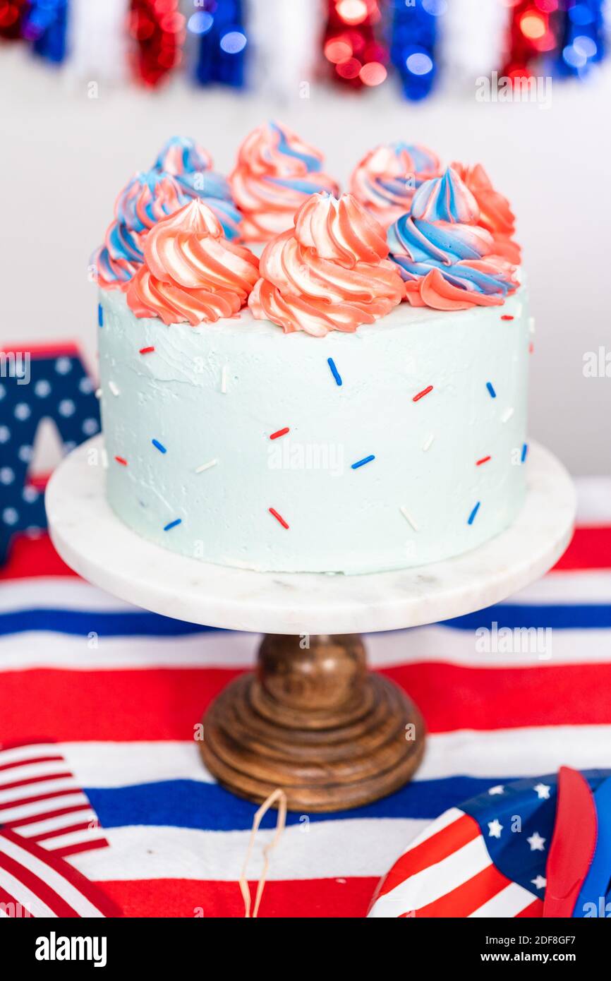 Red, white, and blue round vanilla cake with buttercream frosting for ...