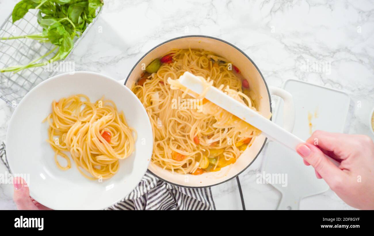 Flat lay. Step by step. Serving a one-pot pasta into a white pasta ...