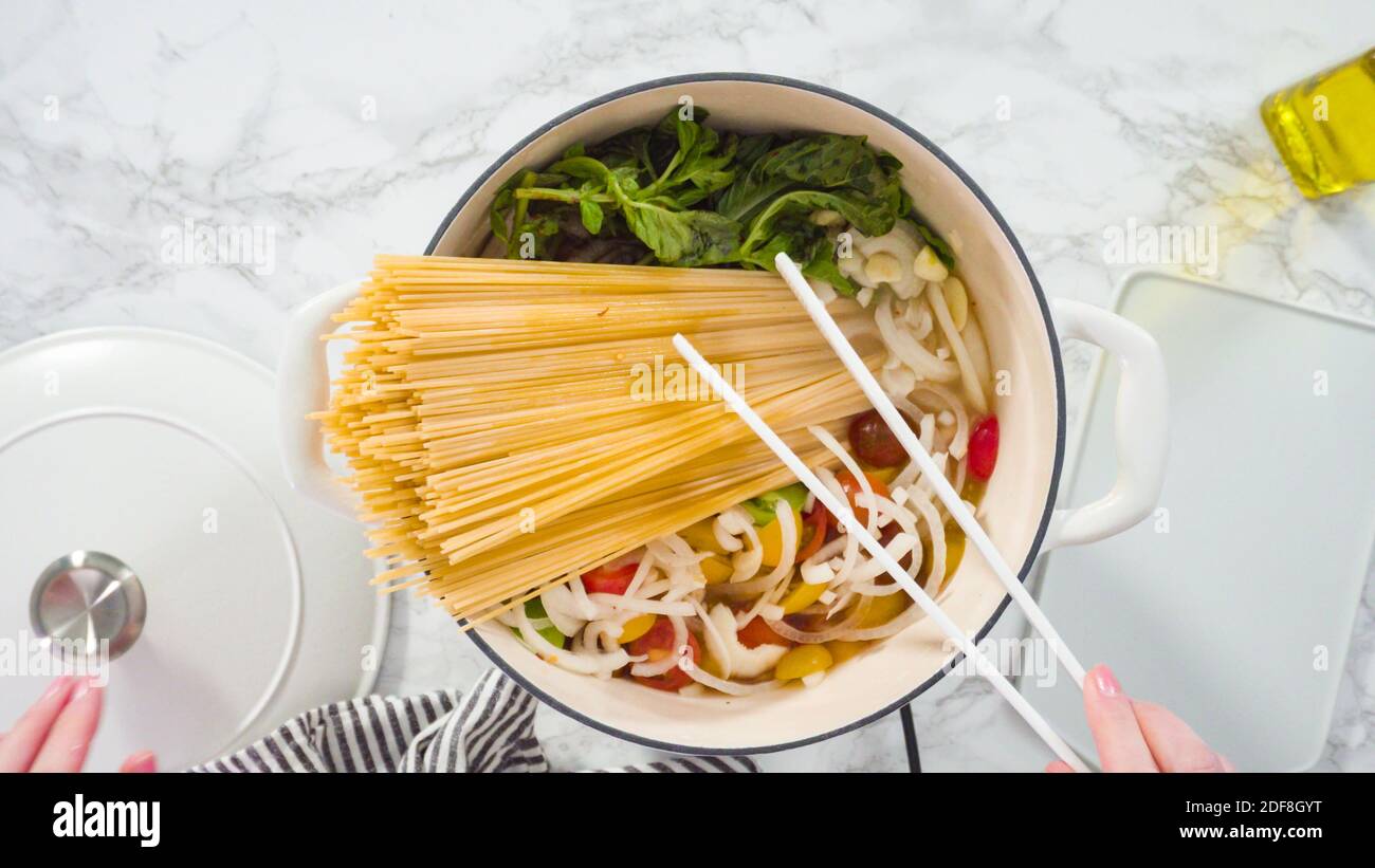 Flat lay. Step by step. Cooking on pot pasta recipe in an enameled cast ...
