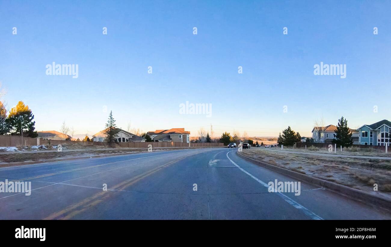 Driving on typical paved roads in a suburban upscale residential ...