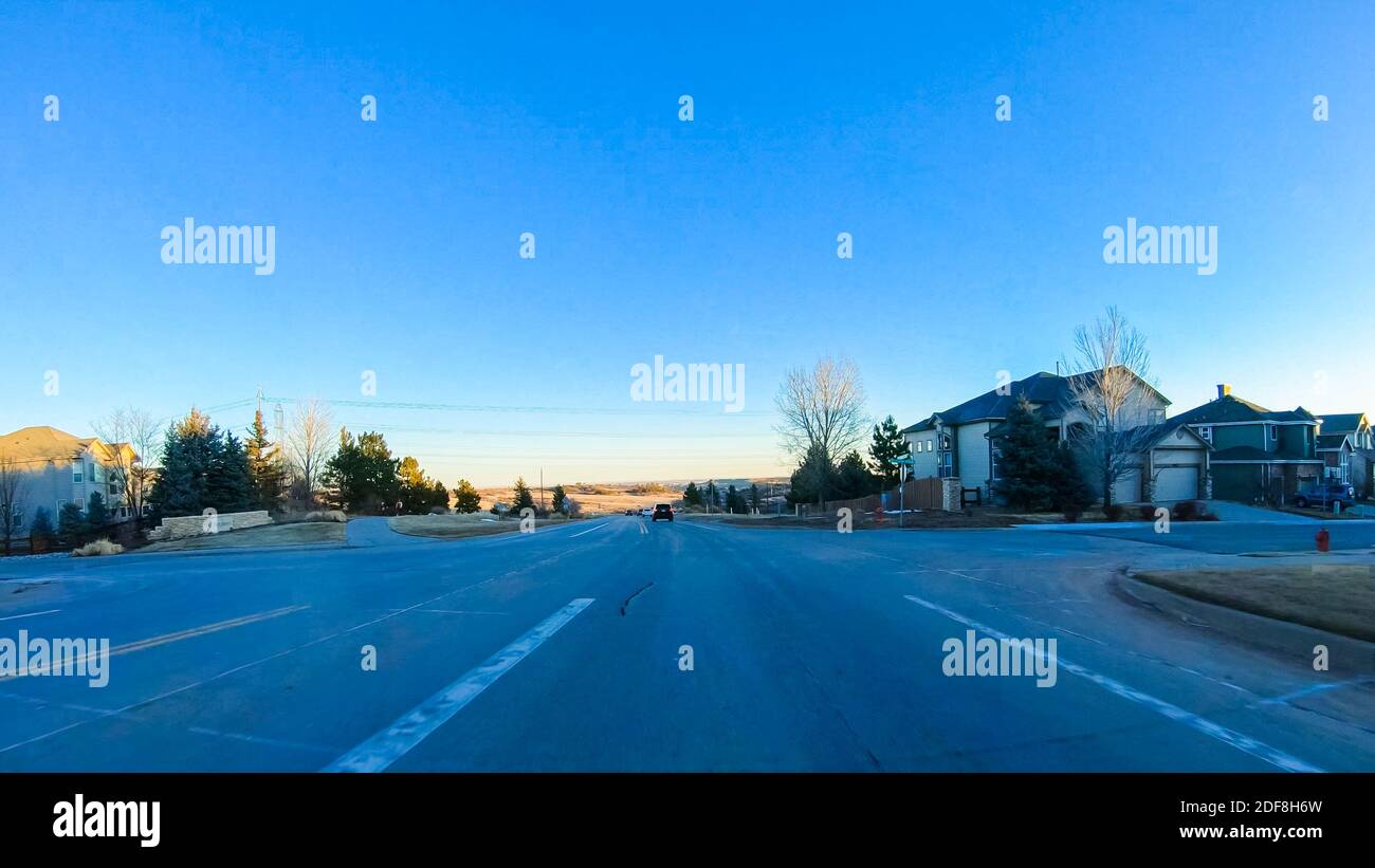 Driving on typical paved roads in a suburban upscale residential ...