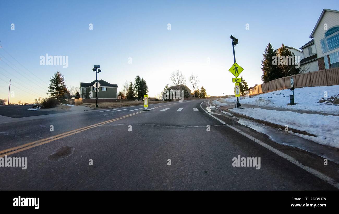 Driving on typical paved roads in a suburban upscale residential ...