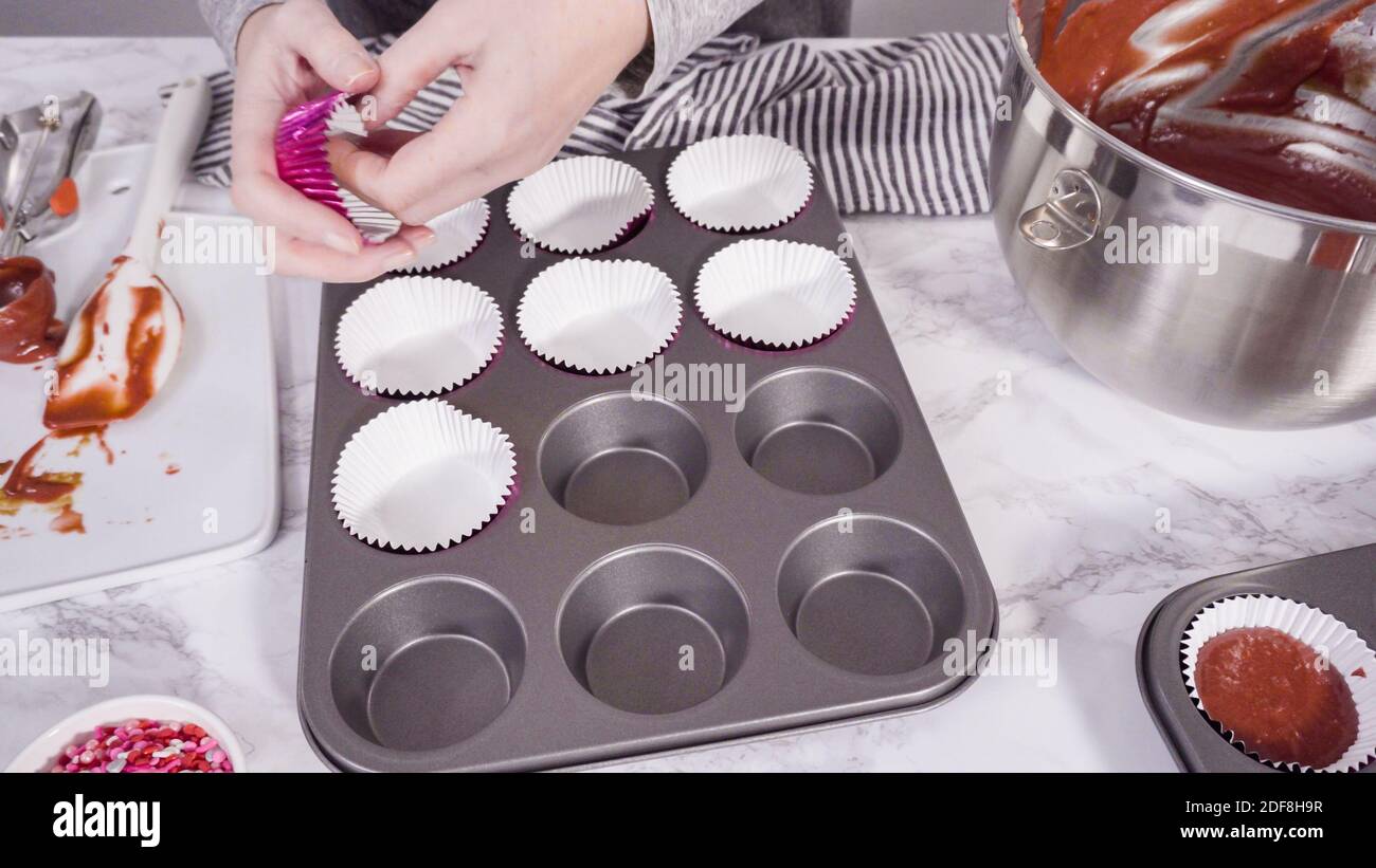 Step by step. Scooping cupcake batter into foil cupcake cups to bake ...
