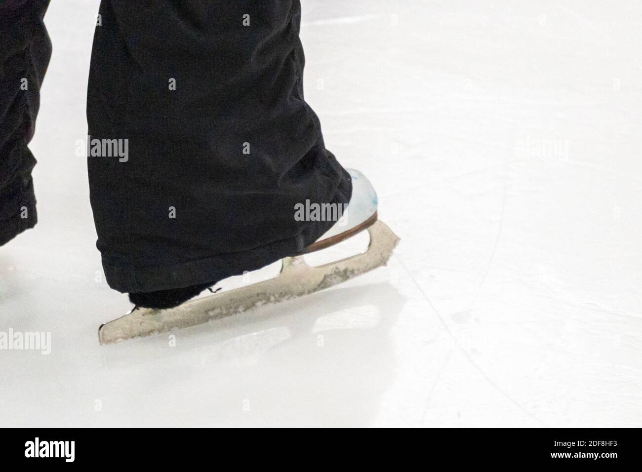 View of figure skating coach feet at the figure skating lesson Stock ...