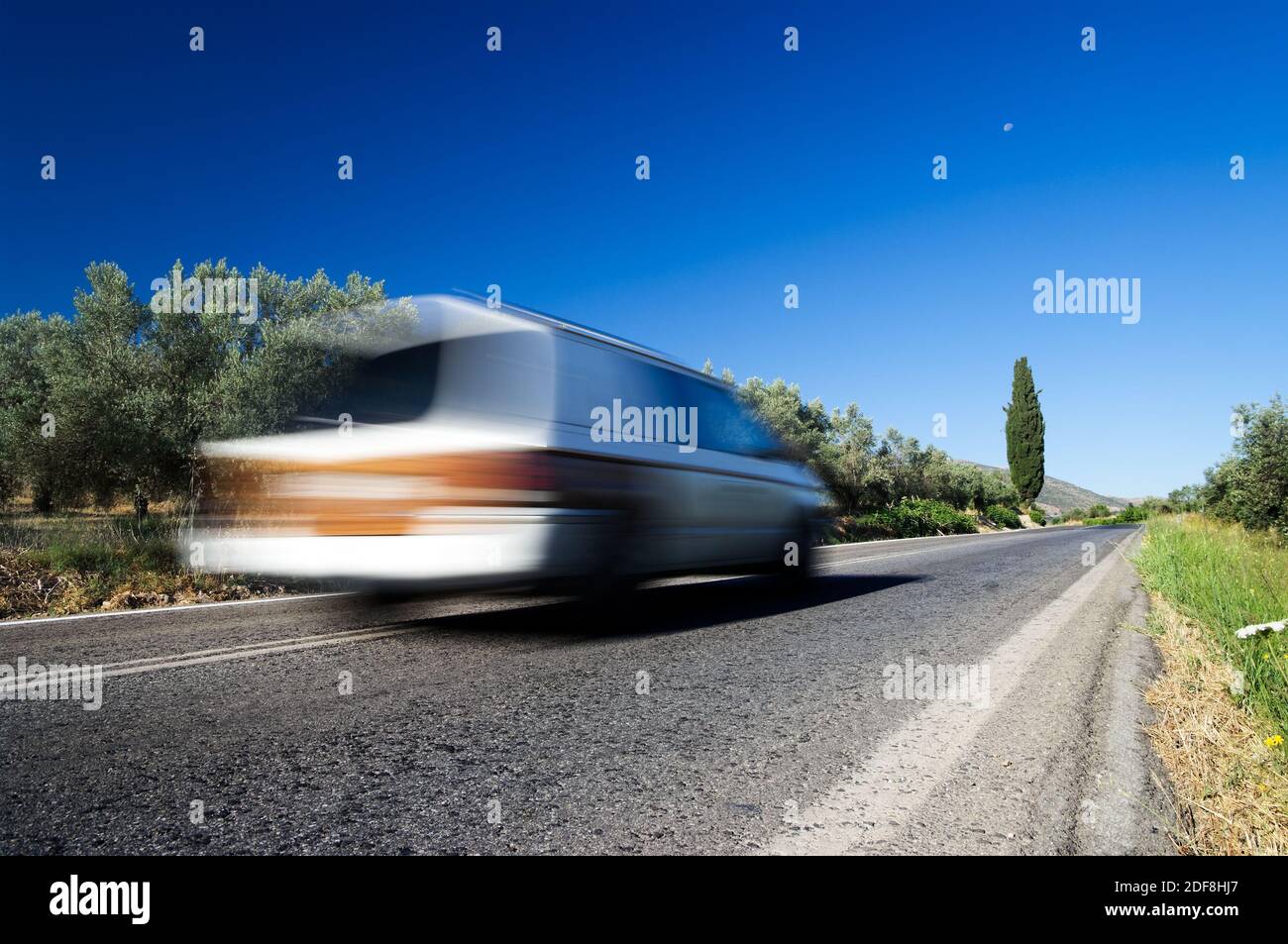 Blue car speeding on the road hi-res stock photography and images - Alamy