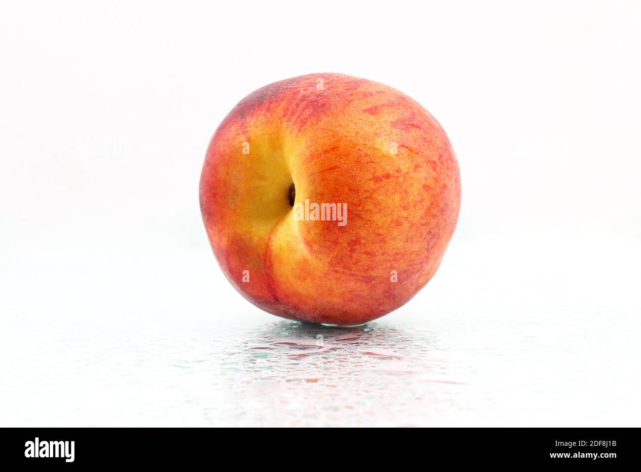 one ripe peach on a white background Stock Photo - Alamy