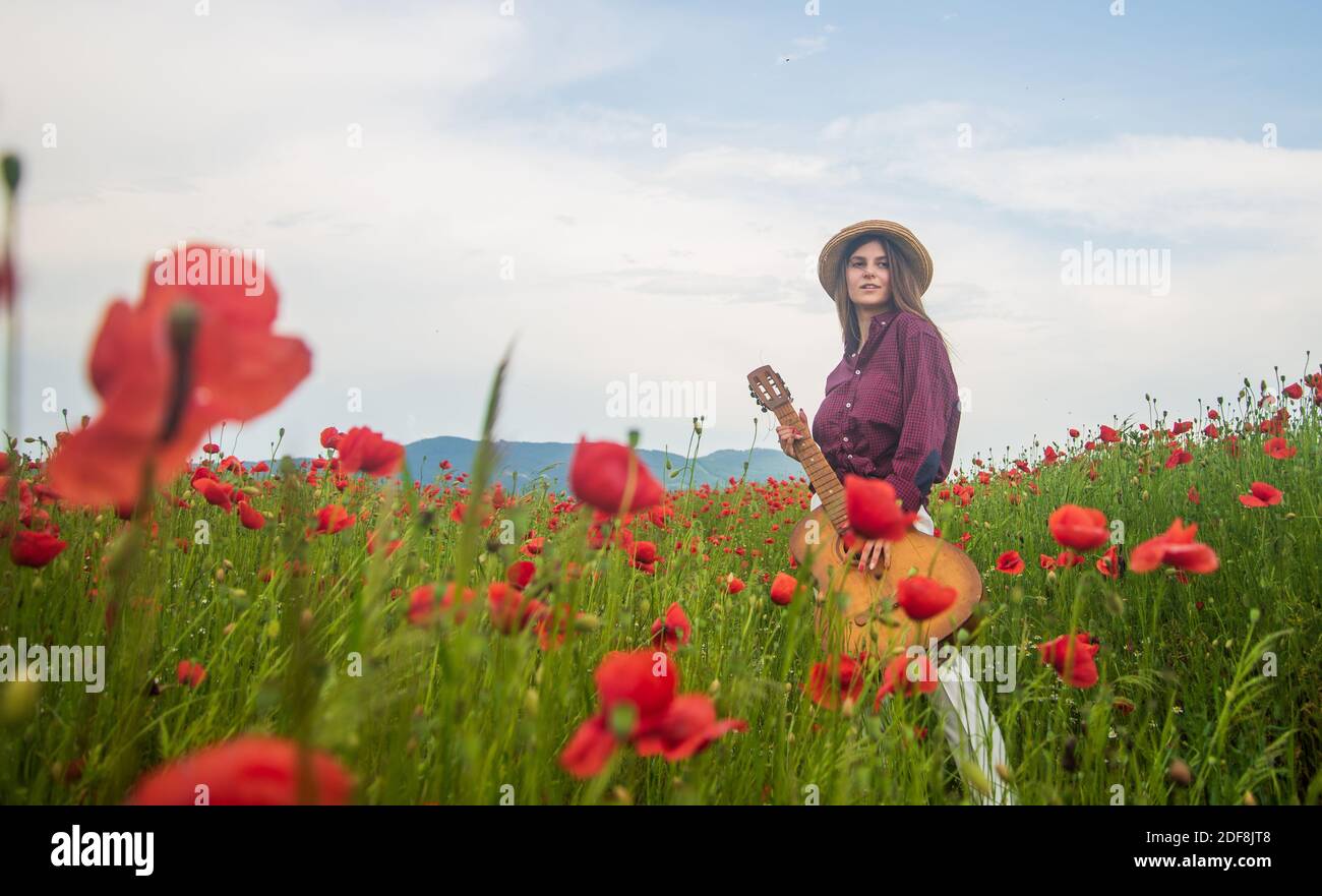 woman walking in poppy flower field during Spring, nature beauty Stock ...