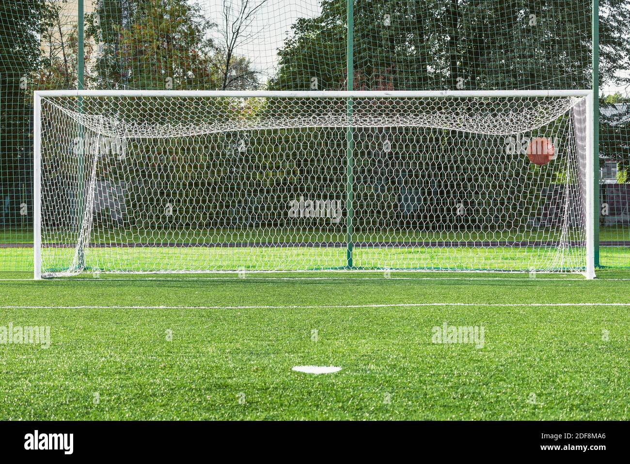 Football inside the net hi-res stock photography and images - Alamy