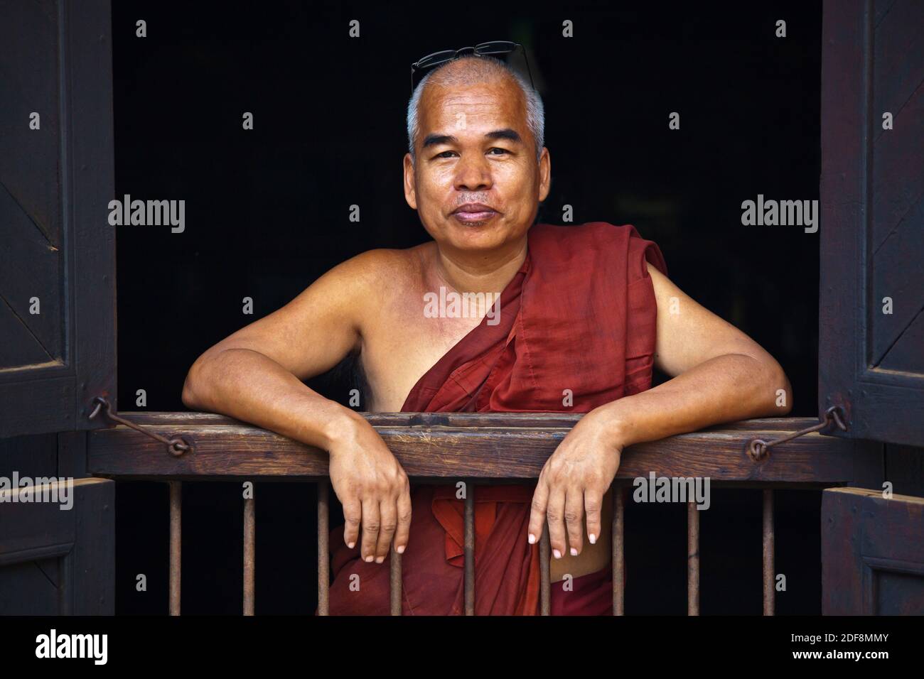 A MONK at the teak BAGAYA KYAUNG MONASTERY which dates back to 1834 in ...