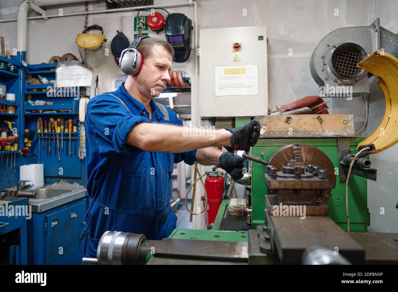Marine engineer officer controlling vessel enginesand propulsion in ...