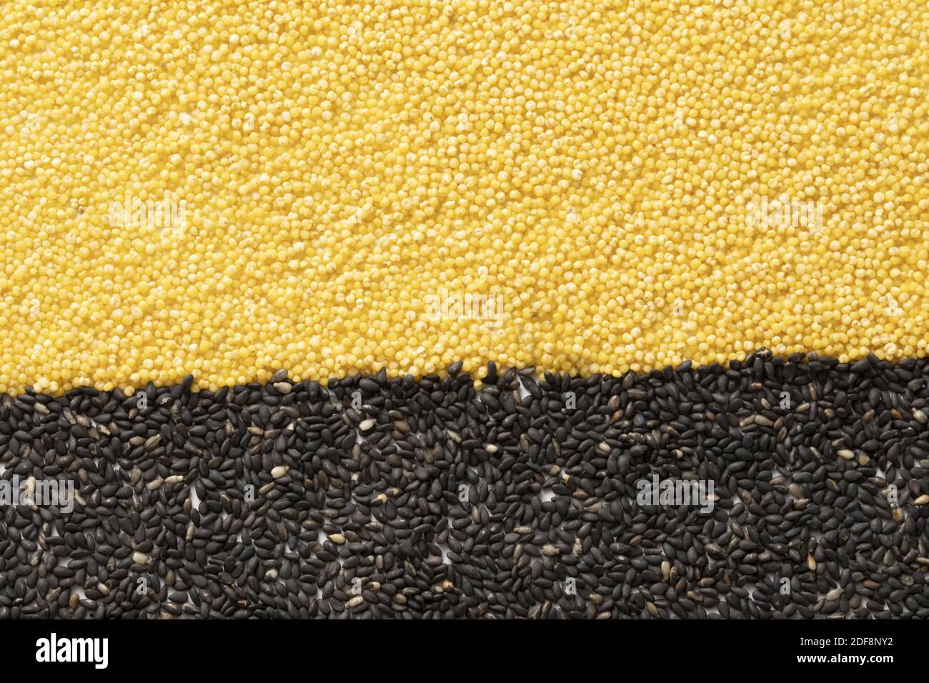 A top view of split yellow millet and black sesame seed pile Stock ...