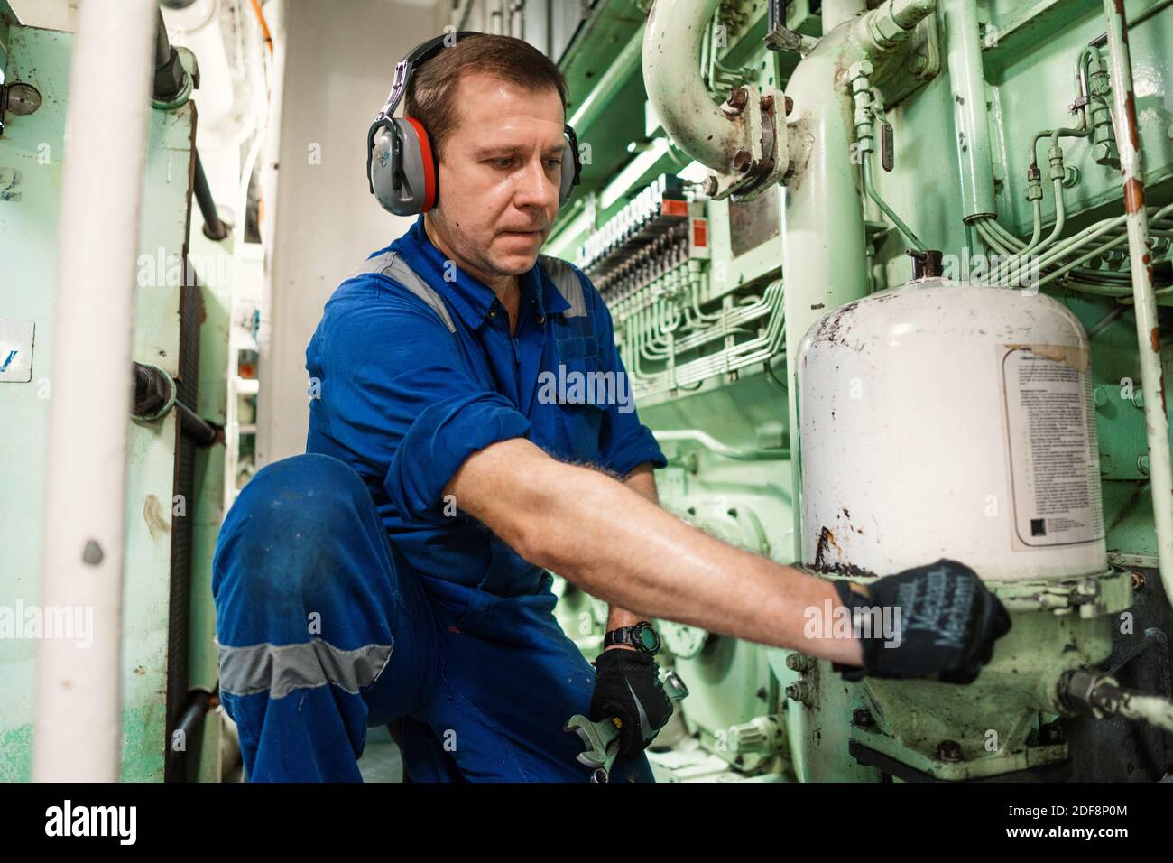 Marine engineer officer controlling vessel enginesand propulsion in ...