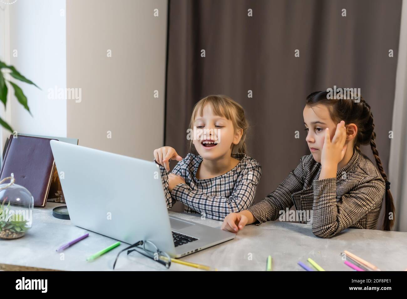 Two little girls doing their school homework Stock Photo - Alamy