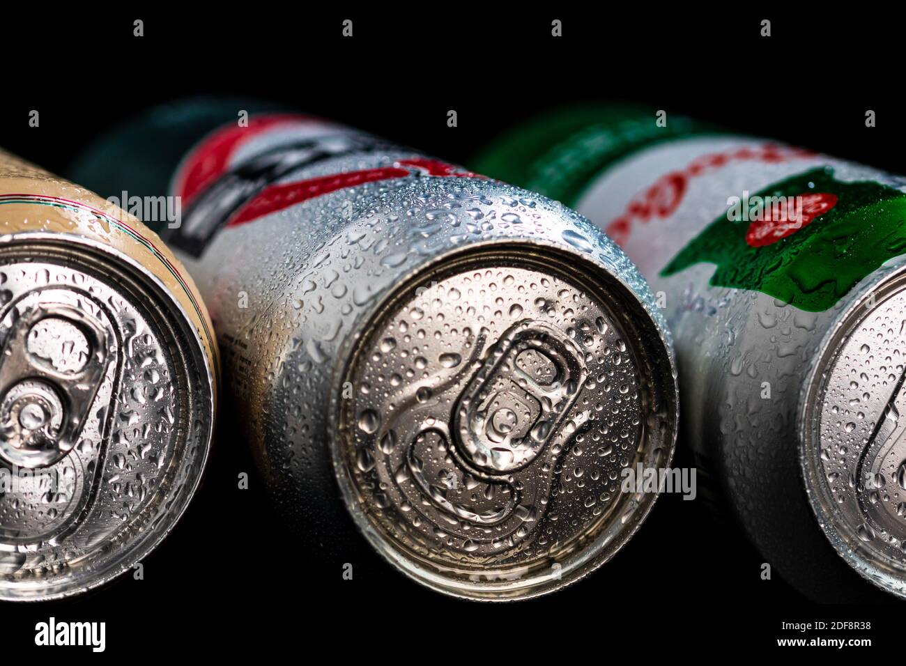 Condensation water droplets on beer cans isolated on black. Bucharest ...