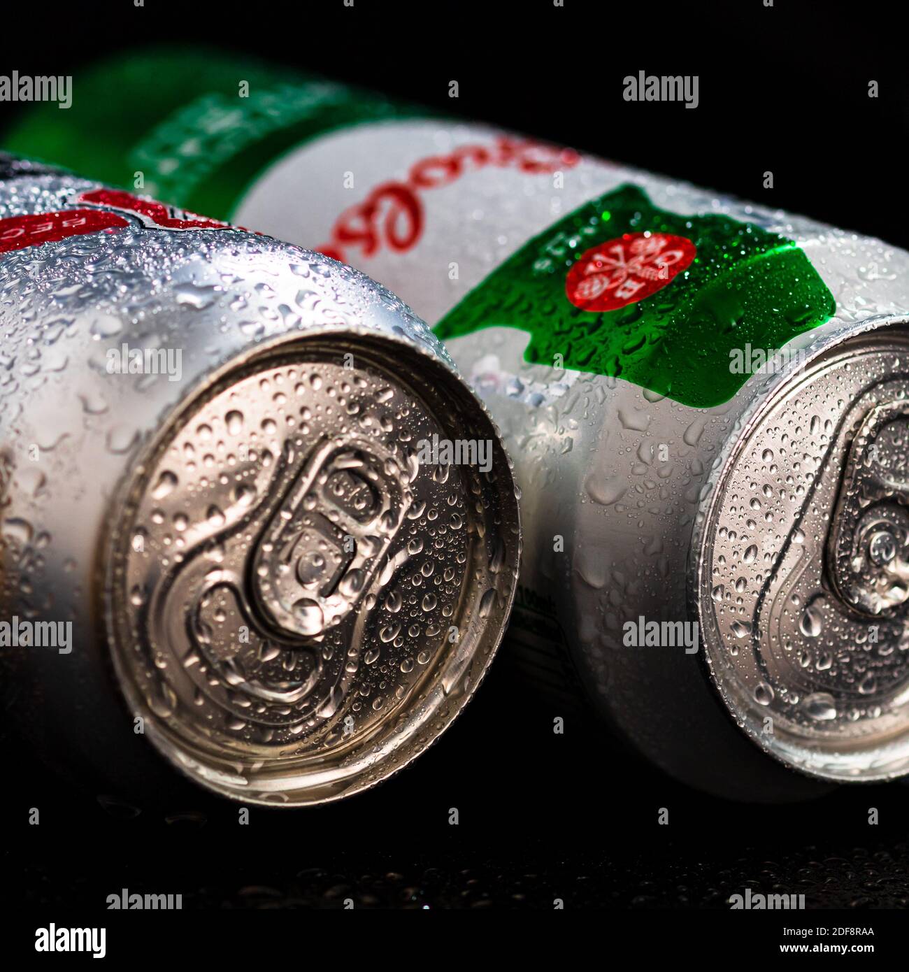 Condensation water droplets on beer cans isolated on black. Bucharest ...