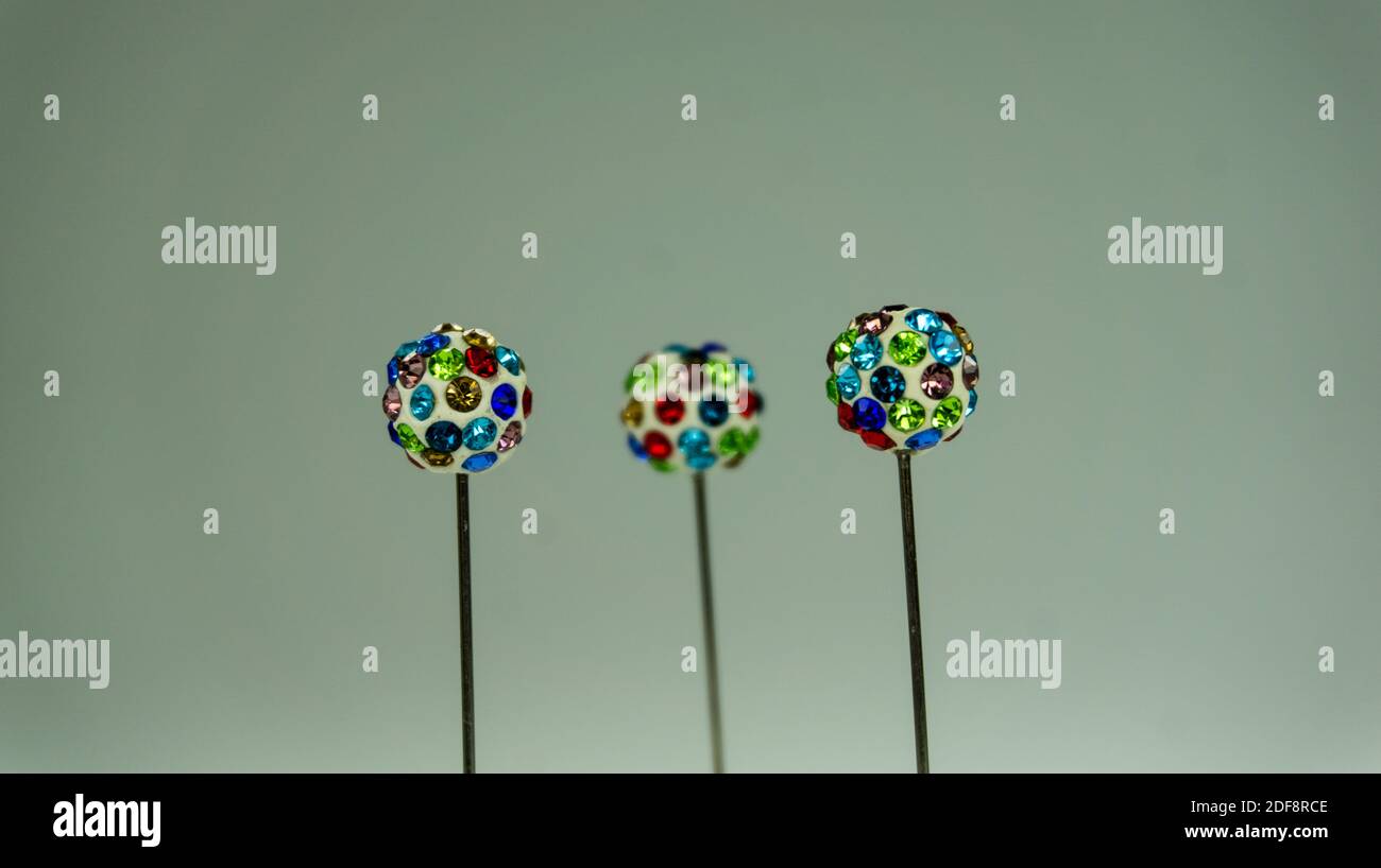 colored needles glowing in the light Stock Photo - Alamy