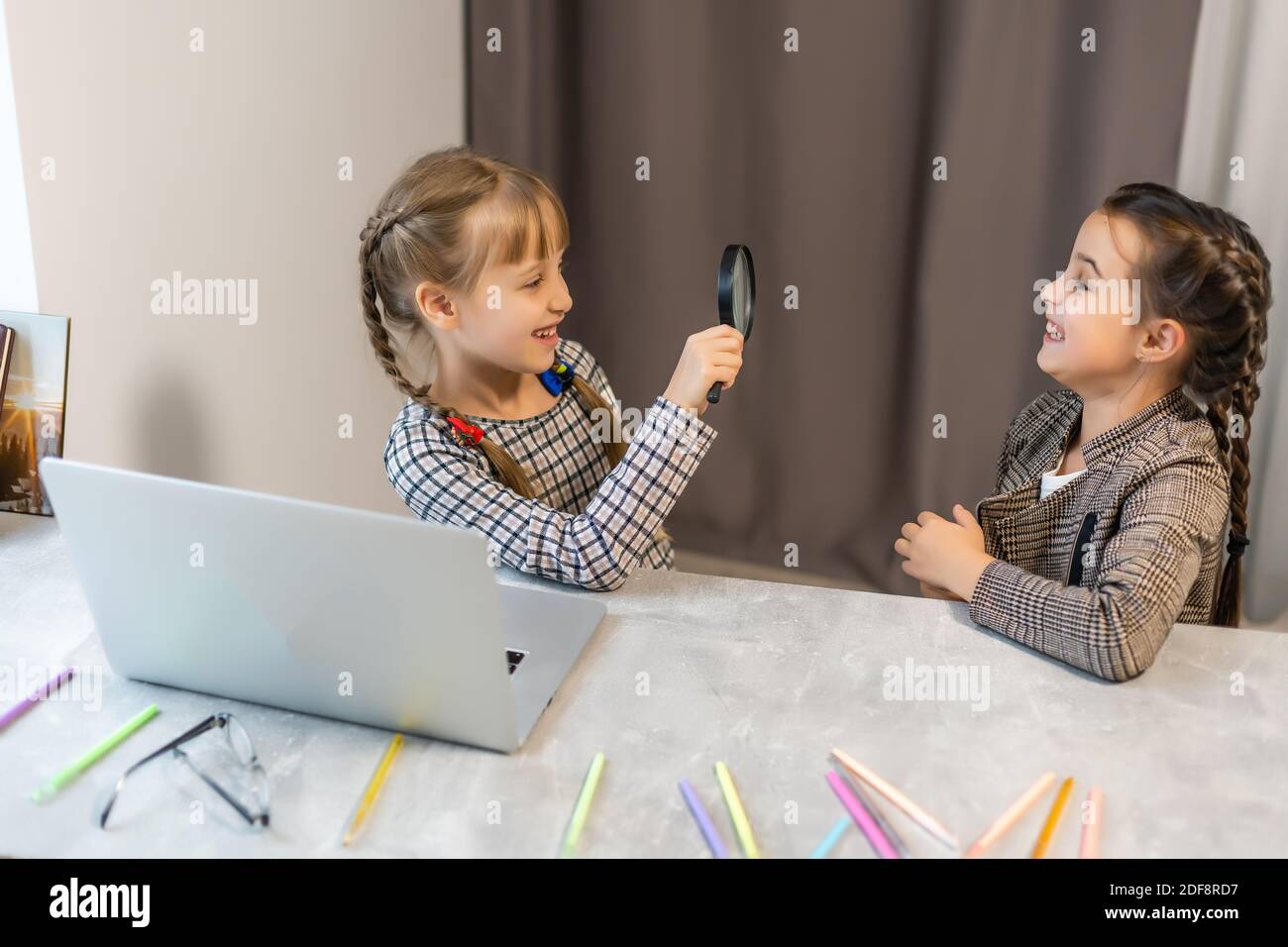Two little girls doing their school homework Stock Photo - Alamy