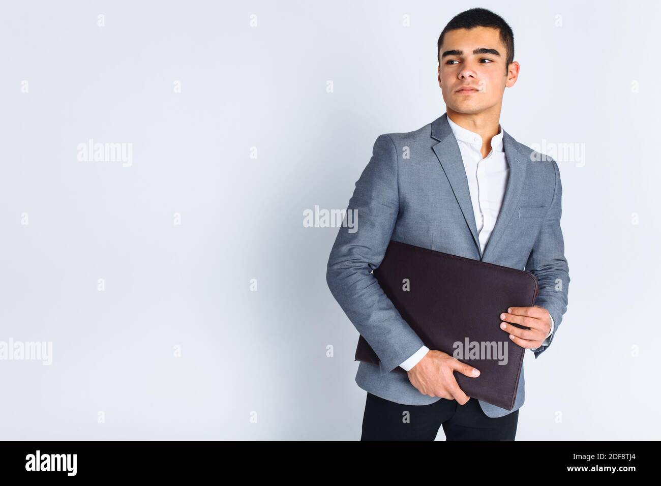 Handsome man with folder man reading a menu, a stylish business guy in ...