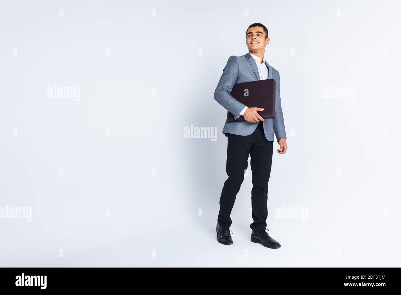 Handsome man with folder man reading a menu, a stylish business guy in ...