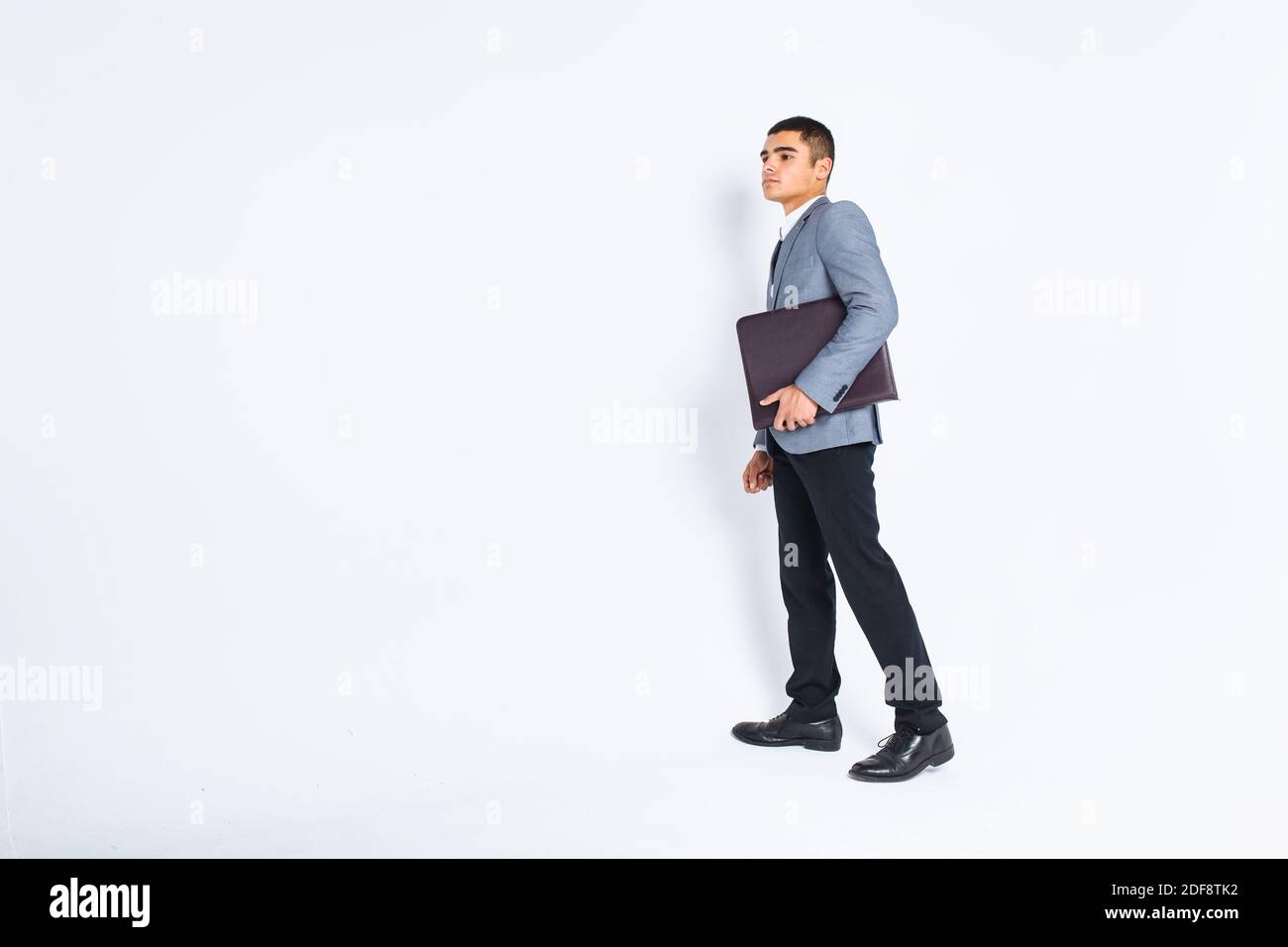 Handsome man with folder man reading a menu, a stylish business guy in ...