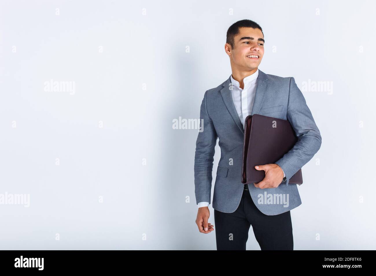 Handsome man with folder man reading a menu, a stylish business guy in ...