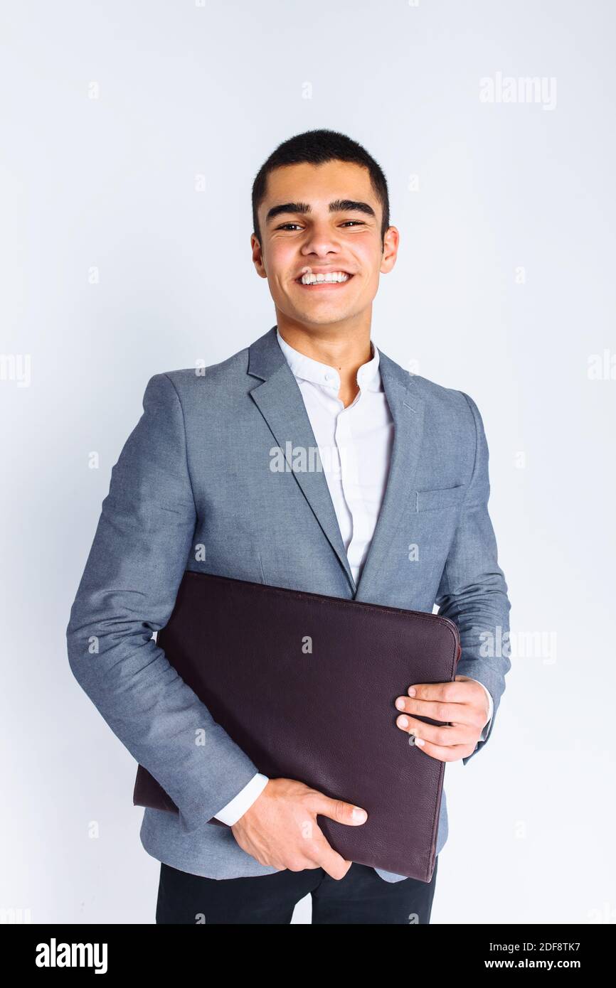 Handsome man with folder man reading a menu, a stylish business guy in ...