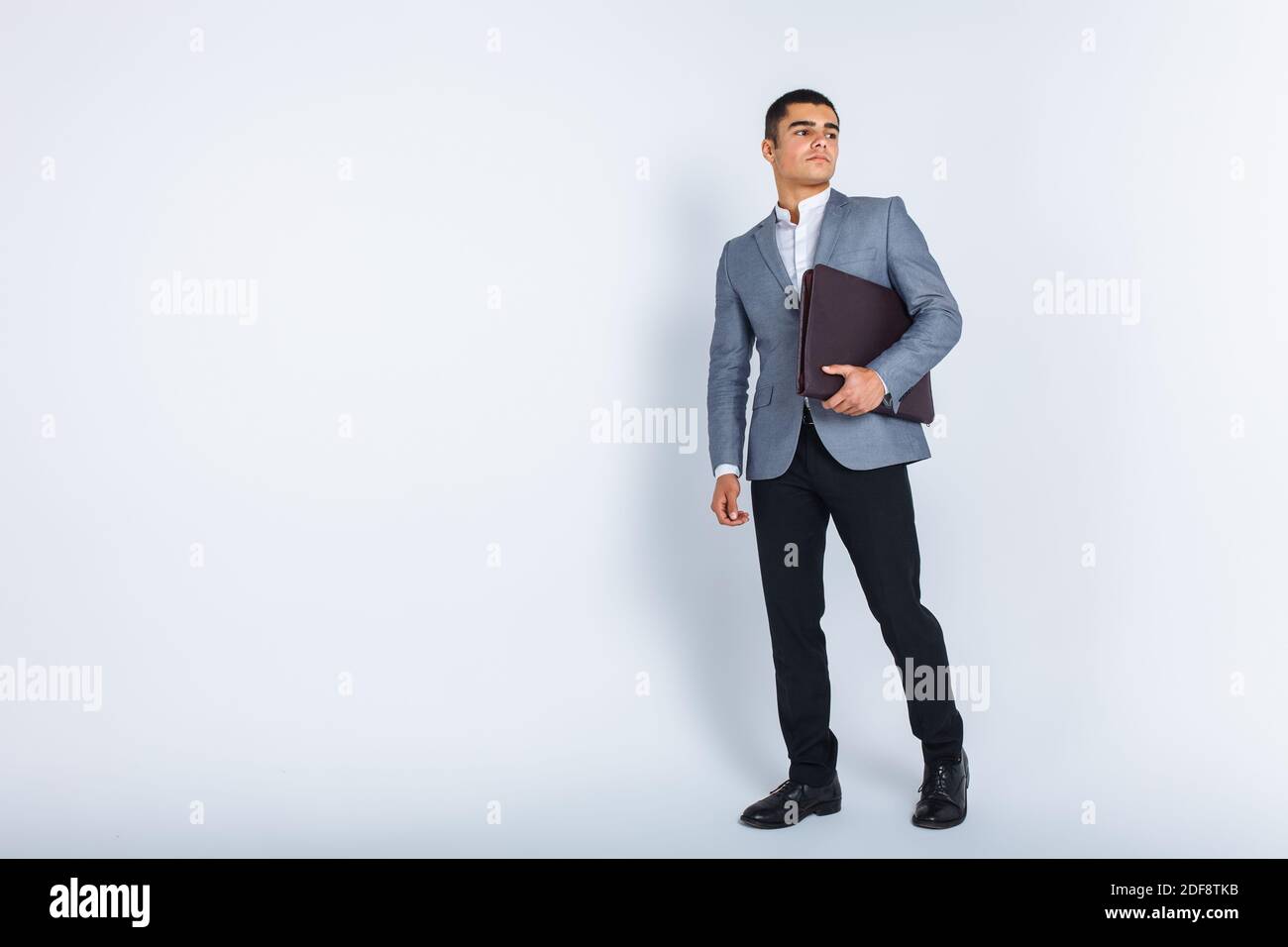 Handsome man with folder man reading a menu, a stylish business guy in ...