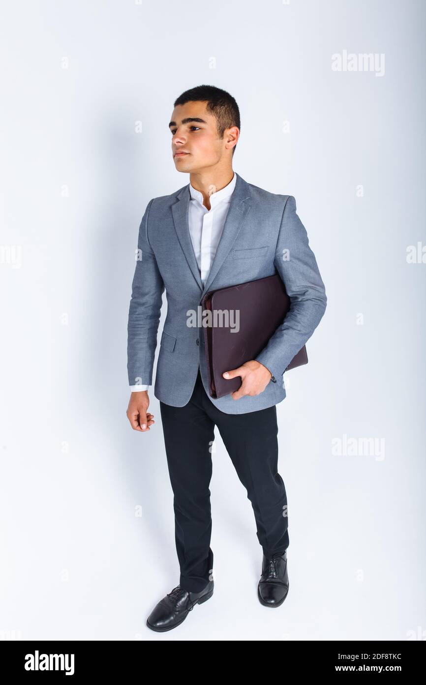 Handsome man with folder man reading a menu, a stylish business guy in ...