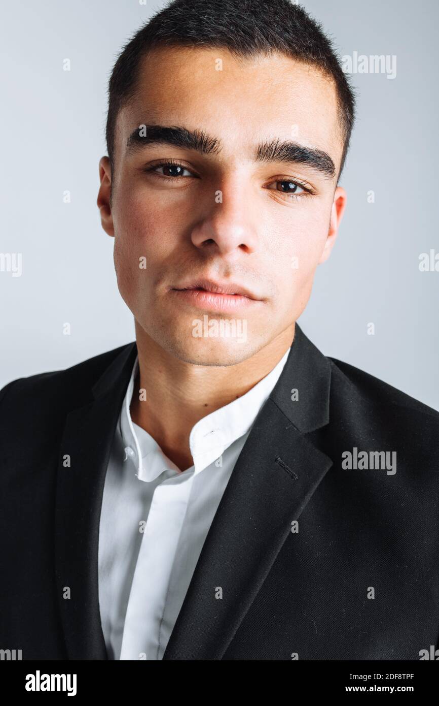 Vertical portrait of a man in the Studio on a white background ...
