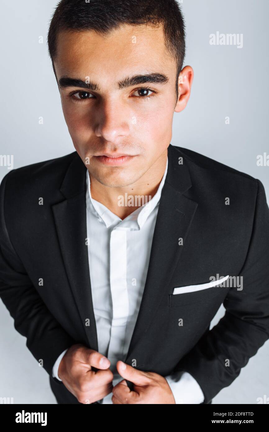 Vertical portrait of a man in the Studio on a white background ...