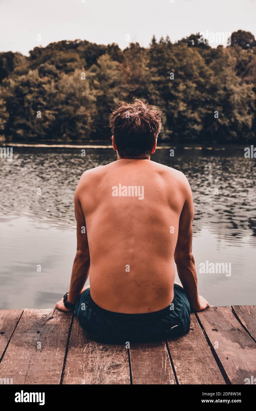 Sitting on a river dock Stock Photo - Alamy