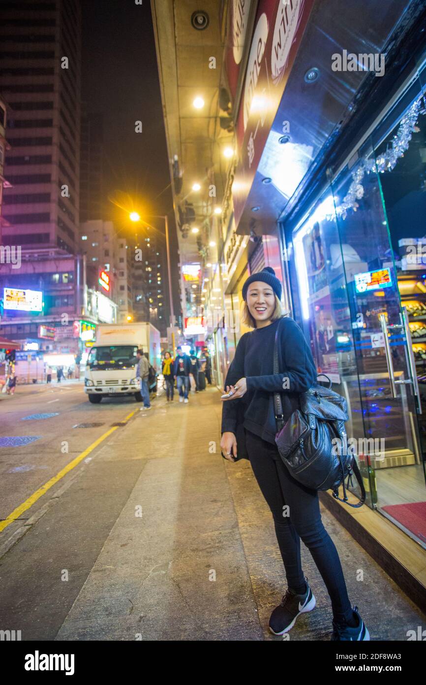 01-22-2015 Hong Kong. Chinese tall young woman smiling to my camera at ...