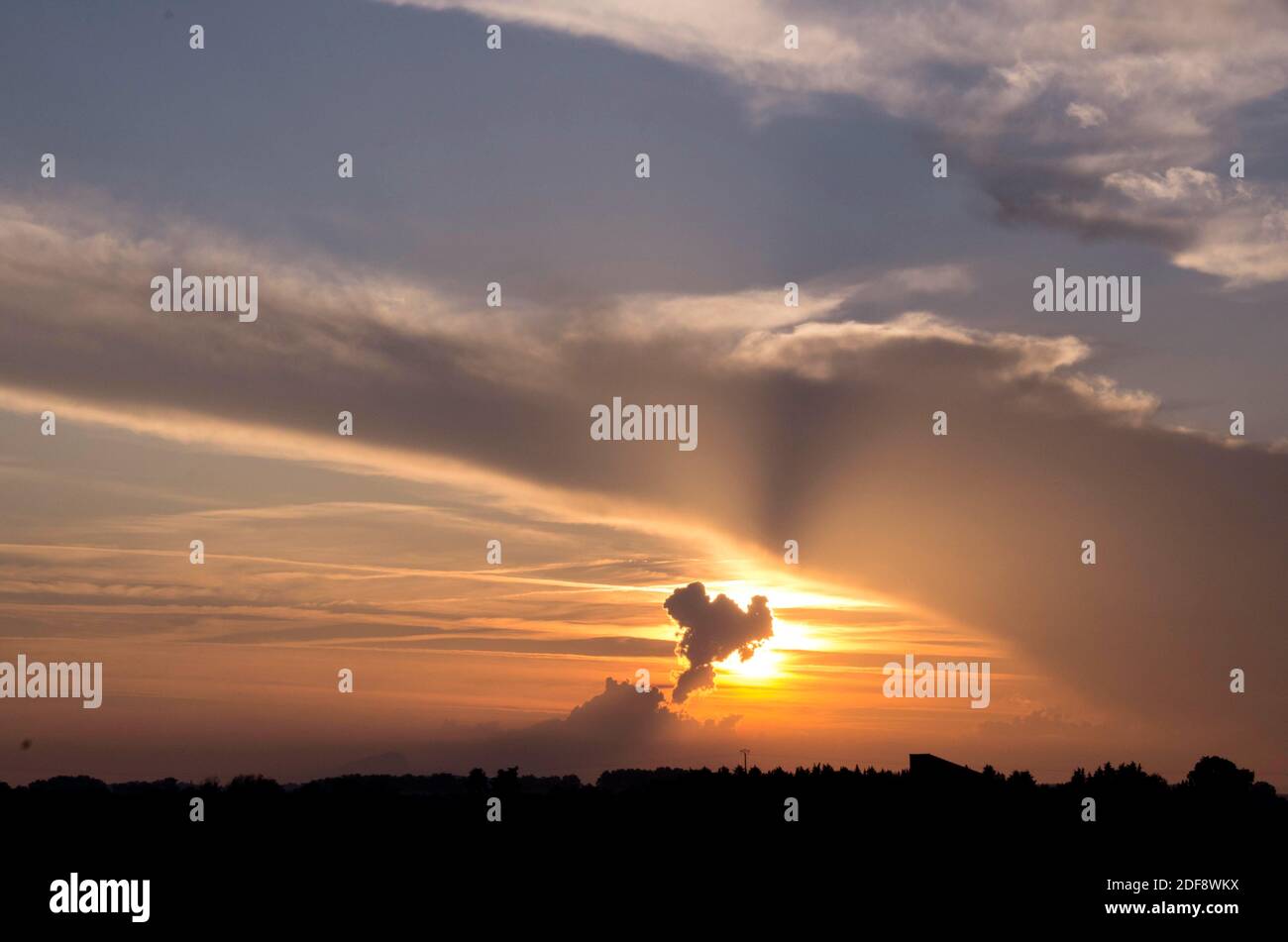 Unusual cloud formation at sunset in the shape of Aladdin's Genie or a ...