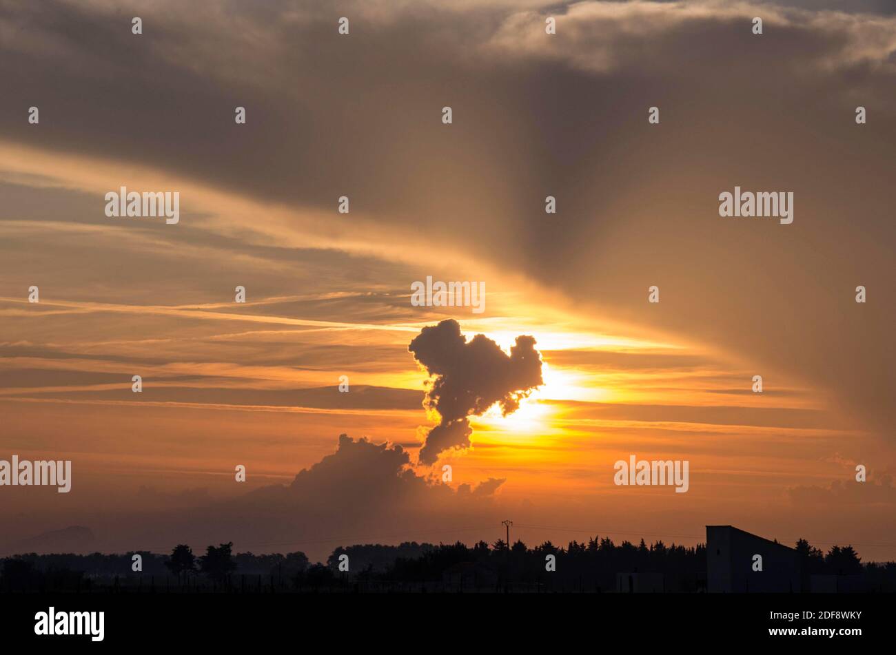 Unusual cloud formation at sunset in the shape of Aladdin's Genie or a ...