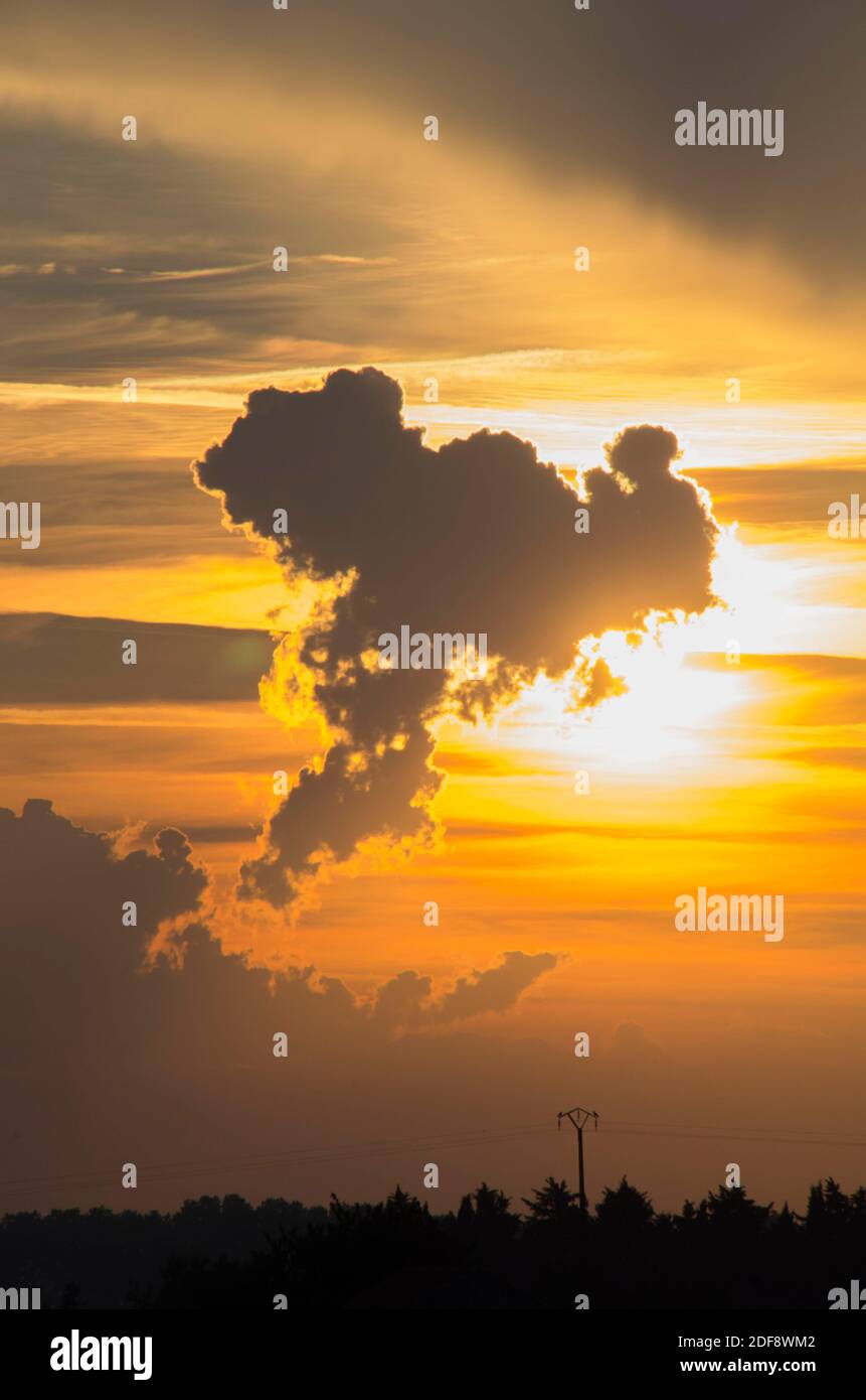 Unusual cloud formation at sunset in the shape of Aladdin's Genie or a ...