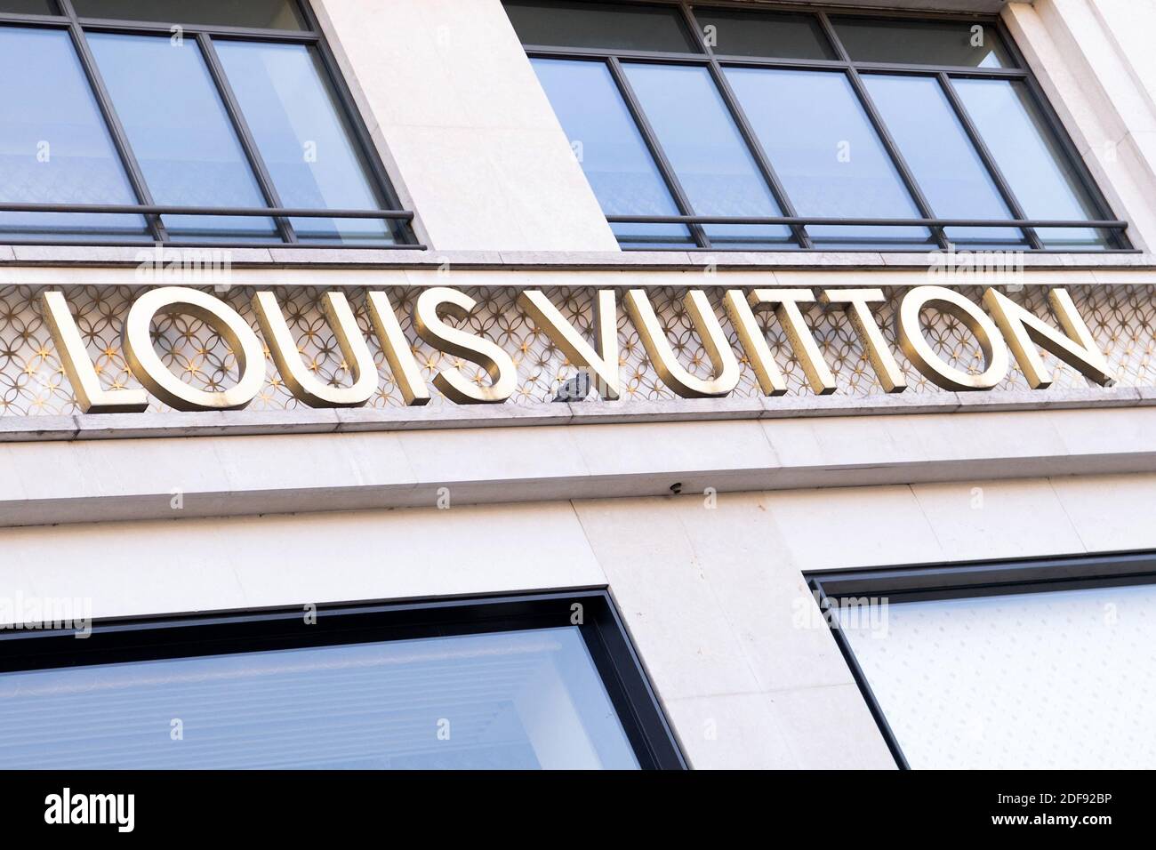 A shop sign of Louis Vuitton in Paris, on April 8, 2020 in Paris ...