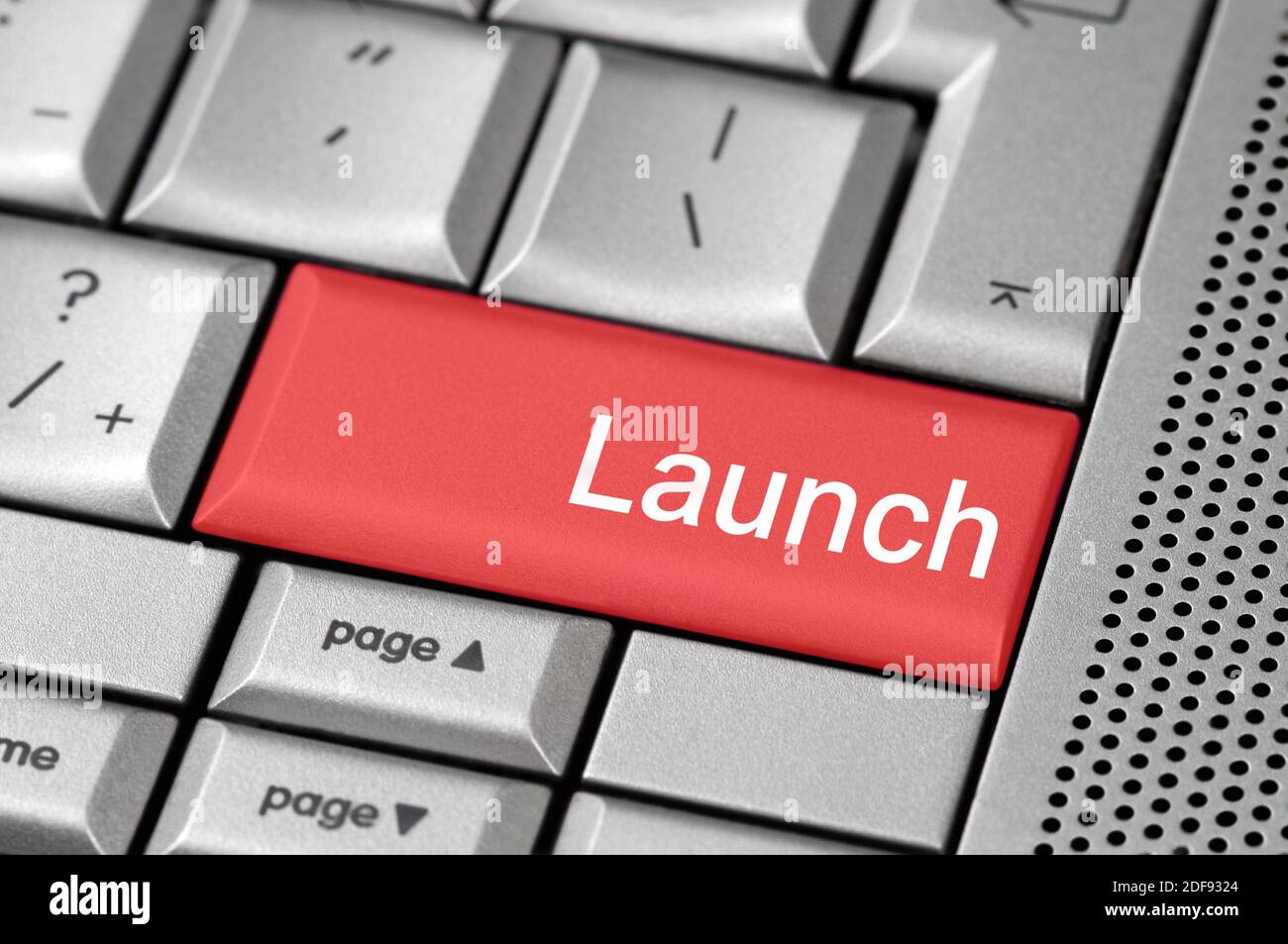 Computer keyboard key colored red labeled with the word Launch Stock ...