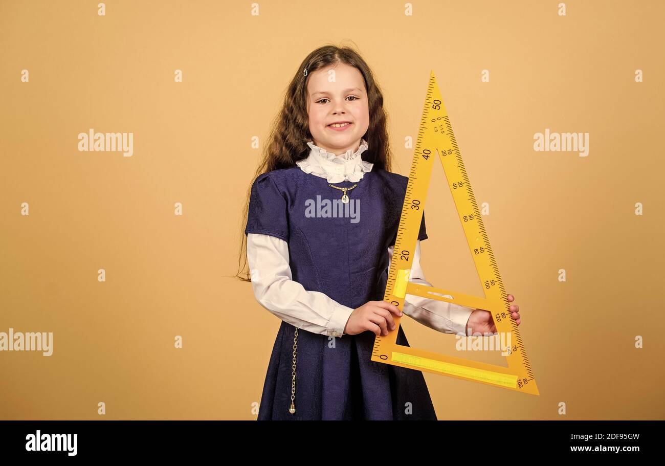 Kid school uniform hold ruler. I love mathematics. Education and school ...