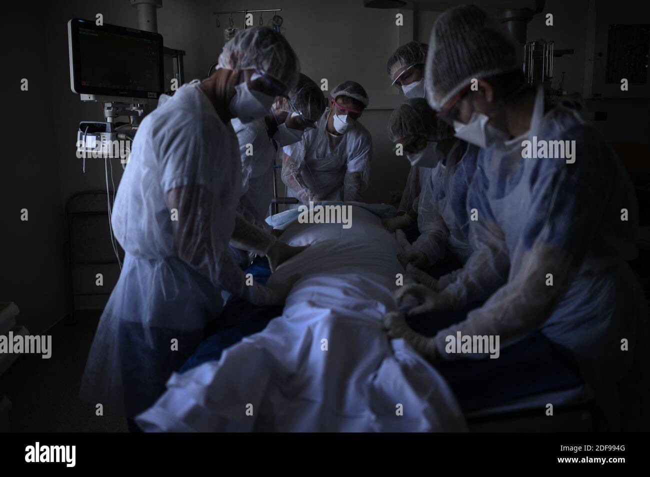 Medical Staff perform a prone decubitus ( decubitus ventral )on a ...