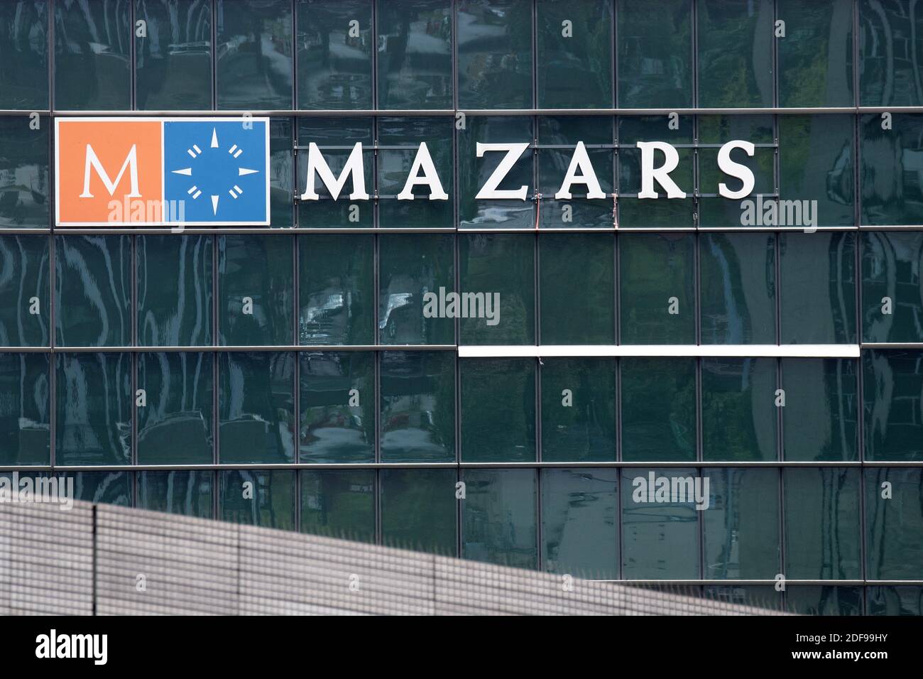A shop sign of MAZARS in the defense district in Paris, on April 17 ...