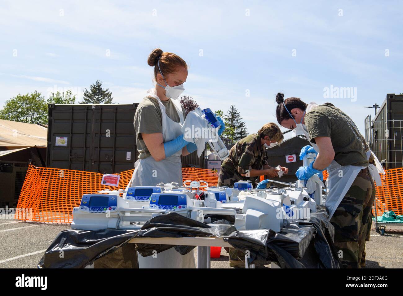 Hand out photo of The military field hospital set up in the parking lot ...