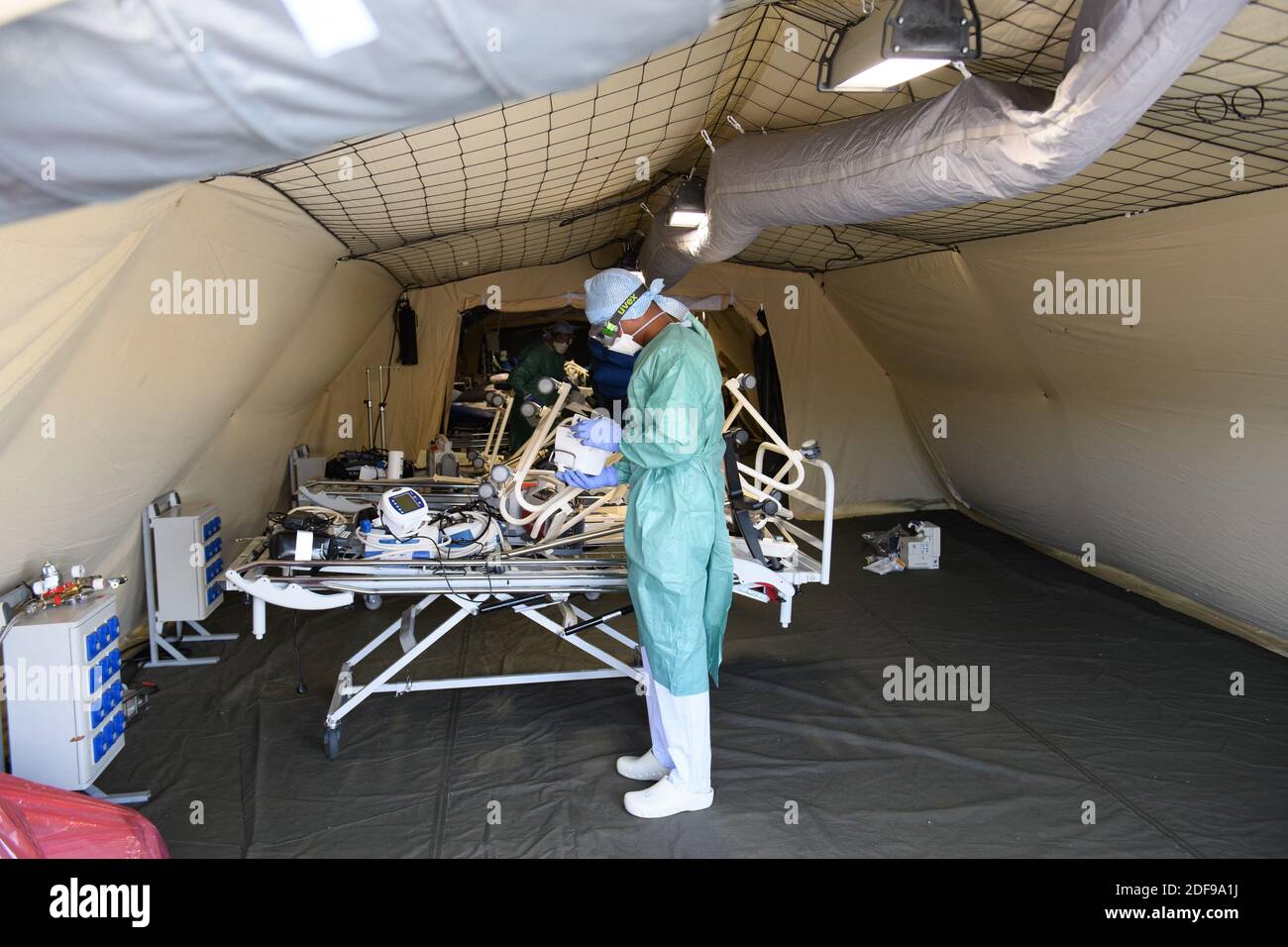Hand out photo of The military field hospital set up in the parking lot ...