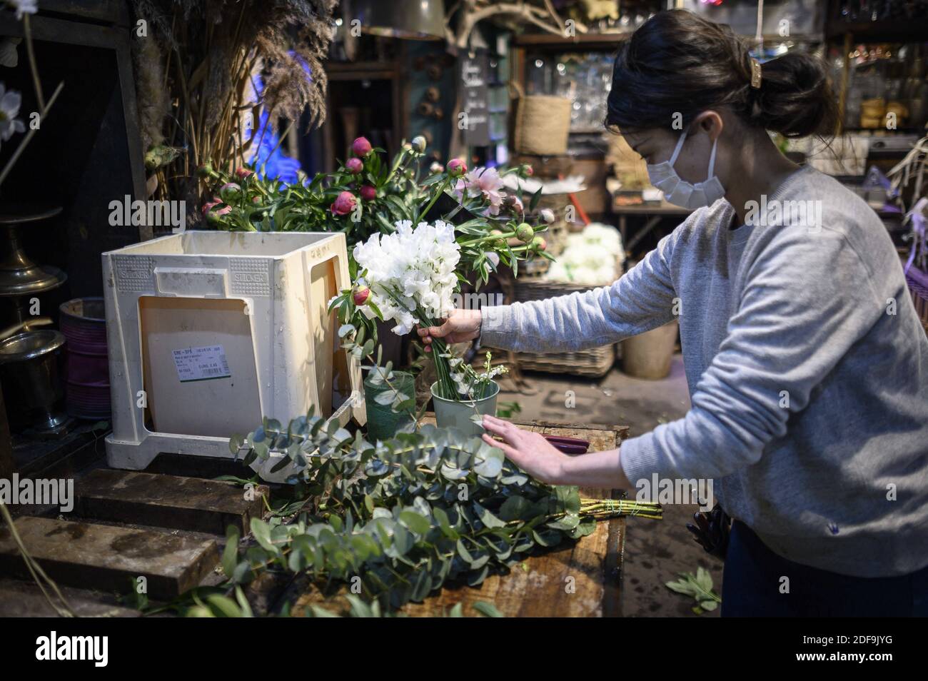 Report on a florist (Maison DESCHAMPS) prepares pots of the traditional ...