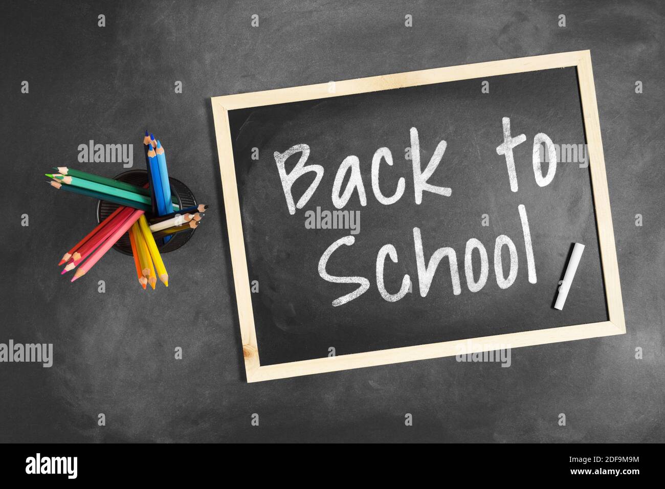 Back to School written on blackboard with multiple colorful colored ...