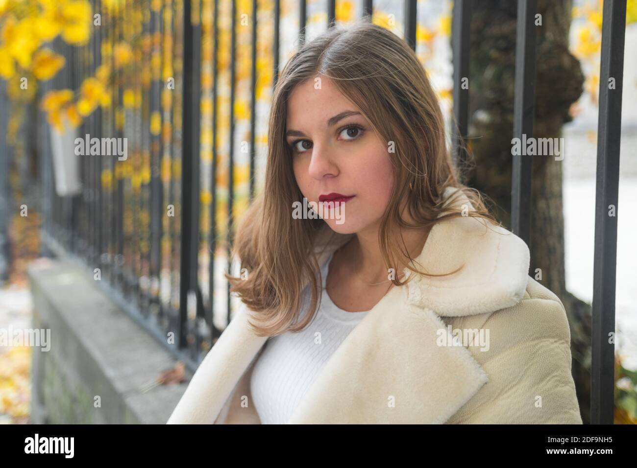 Beautiful young blond girl (model) turning her head on the left and ...