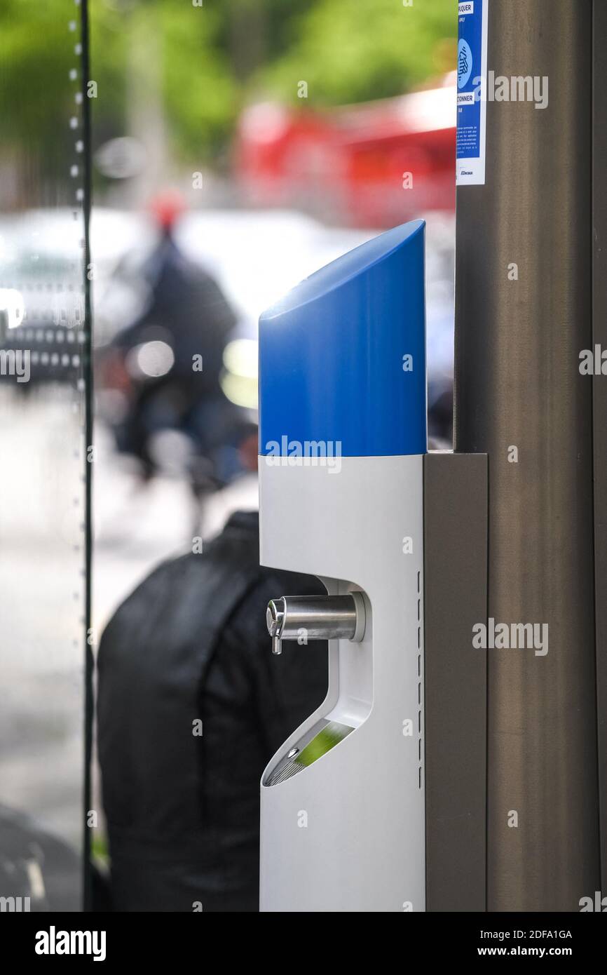 A hand gel dispenser at bus stop in Paris, France, on May 12, 2020, on ...