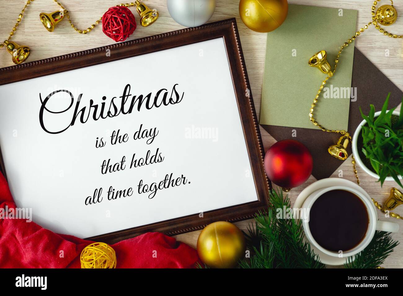 Wood frame with season's greetings wish and ornament balls decoration ...