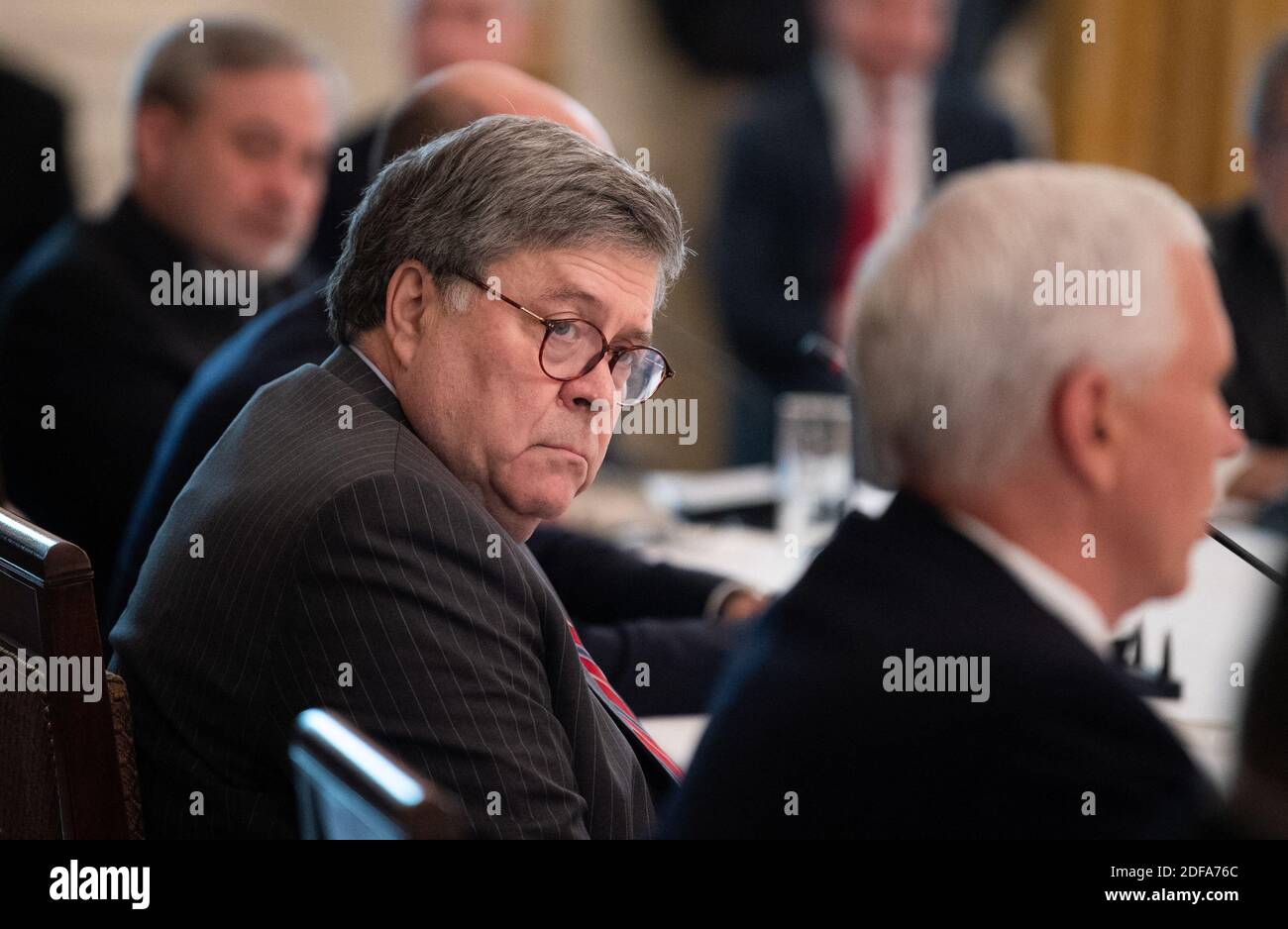 Attorney General William Barr listens as President Donald Trump ...