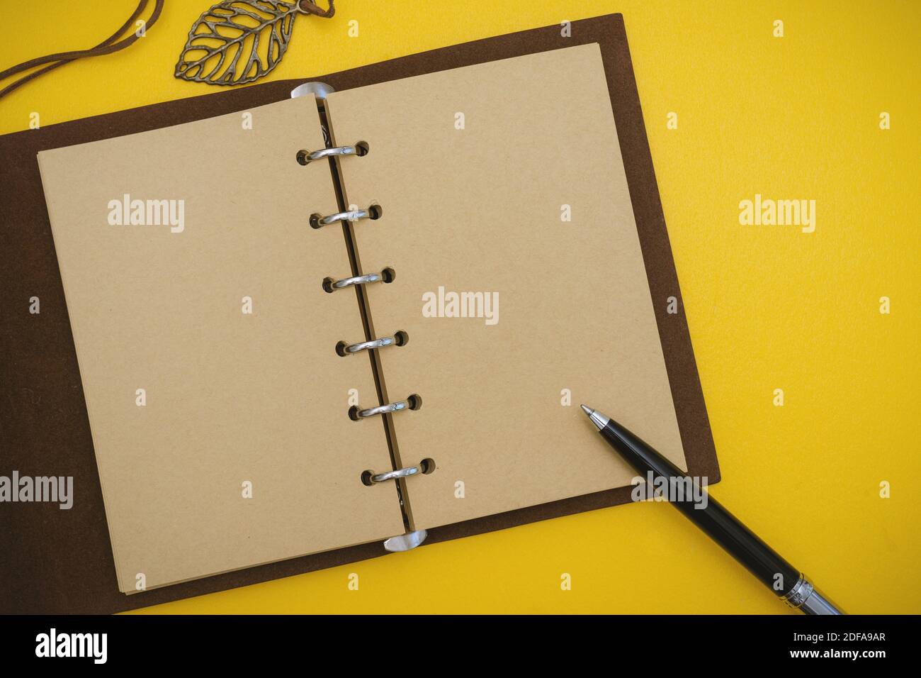 Overhead View of Close Up of Rustic Notepad on Yellow Background Stock ...