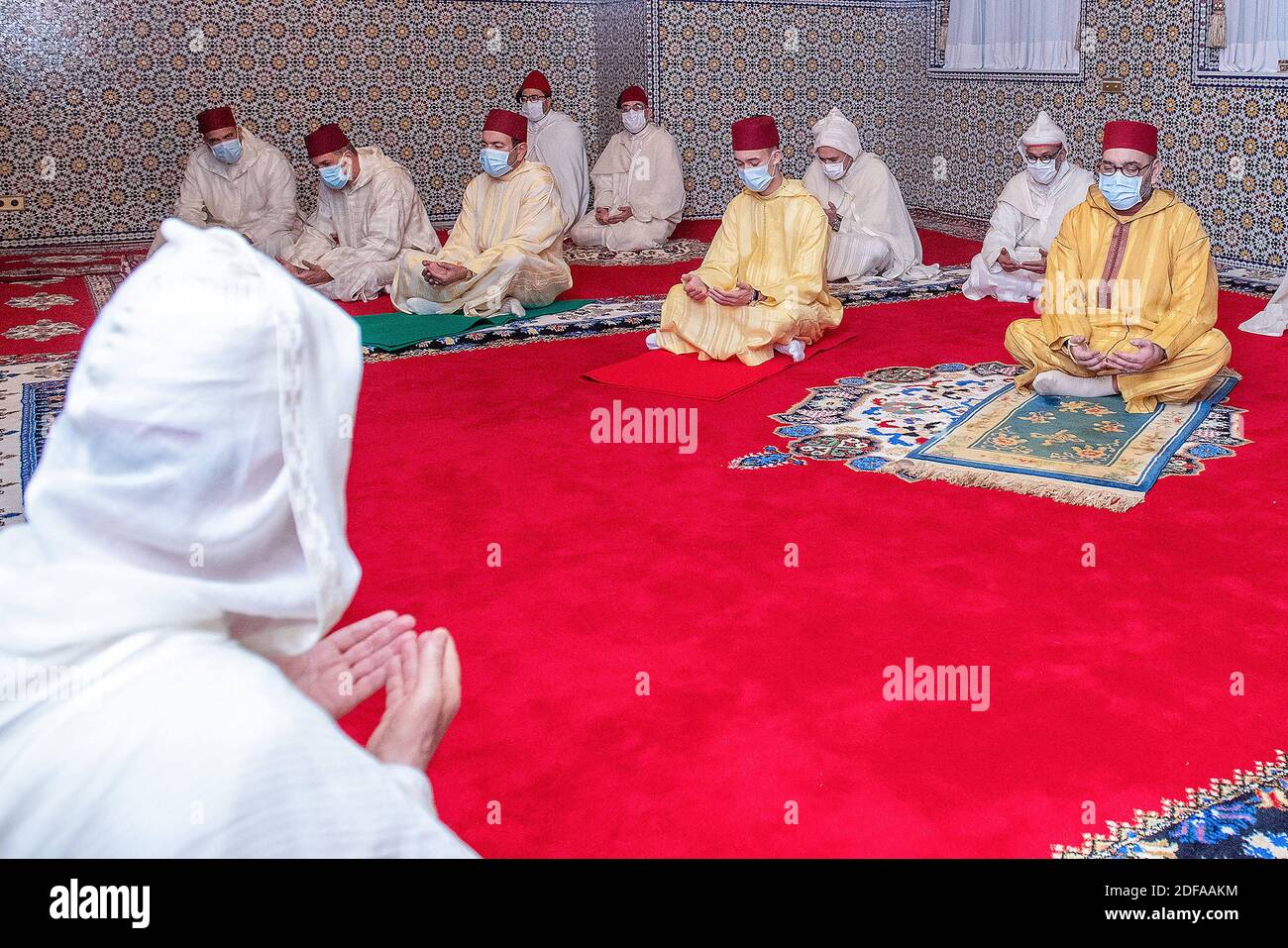 King Mohammed VI of Morocco performs Eid Al-Fitr prayer with his son ...